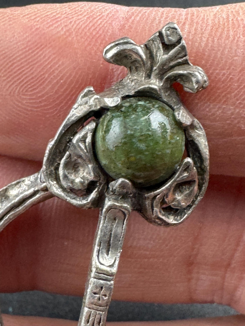 Signed Miracle green glass brooch, signed Scottish Celtic style